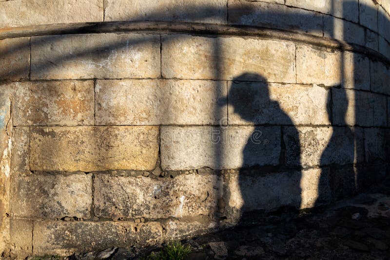 Silhouette of the Shadows of People on the Stone Wall Stock Photo ...
