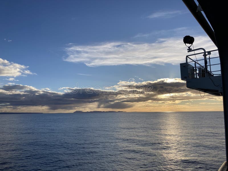 Silhouette of a Ships Bridge Wing with the Sun Setting in a Calm Ocean ...