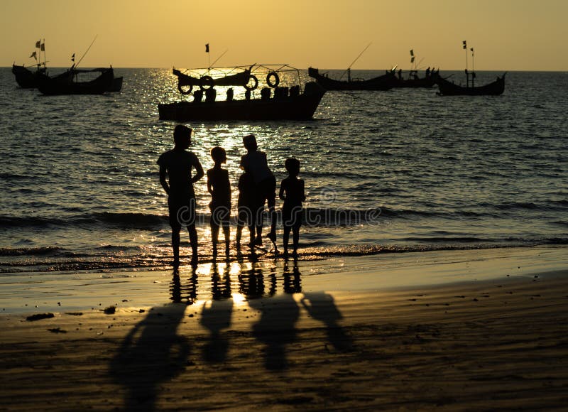 Silhouette Shot of Young People at the Beach during Sunset Editorial ...