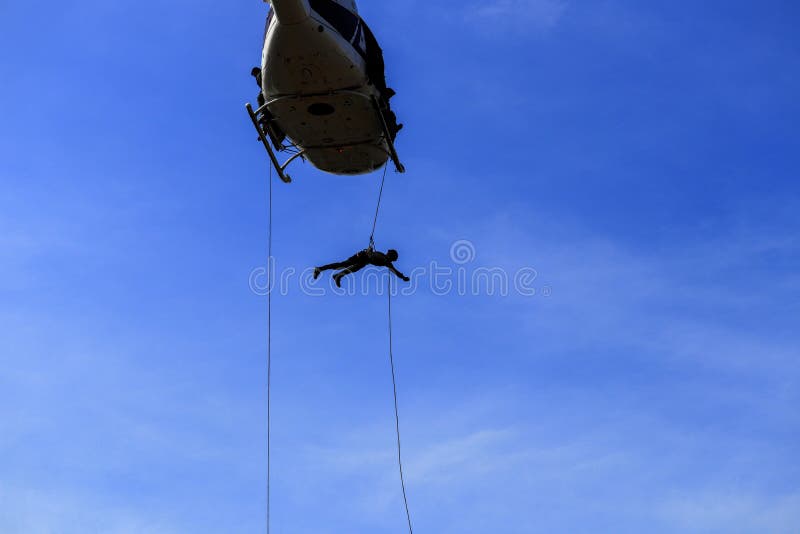 Silhouette Soldier Jump Rope from Helicopter in Blue Sky Stock Image ...