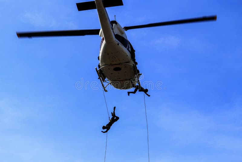 Silhouette Soldier Jump Rope from Helicopter in Blue Sky Stock Photo ...