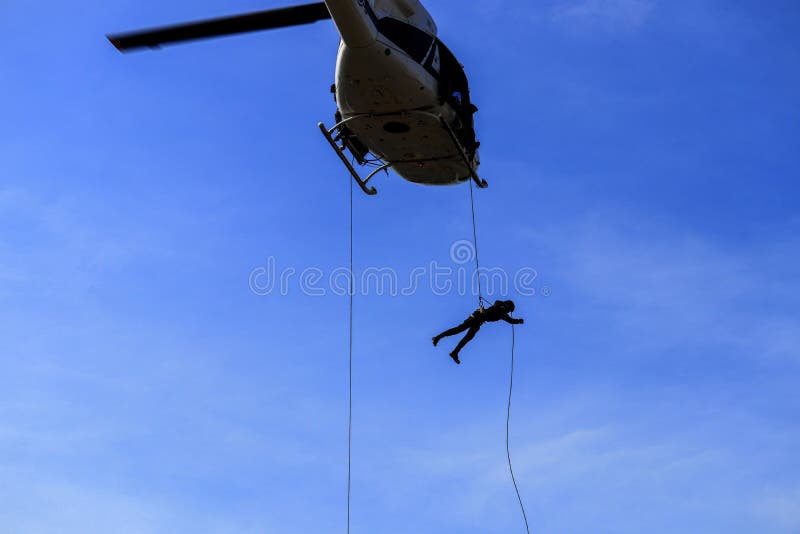 Silhouette Soldier Jump Rope from Helicopter in Blue Sky Stock Photo ...