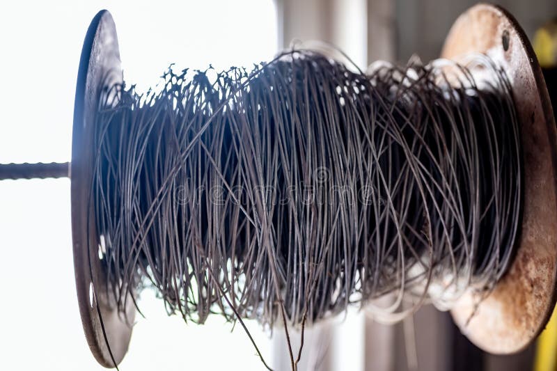 Silhouette Spool of Thick Wire on a Spindle. Stock Photo - Image of ...