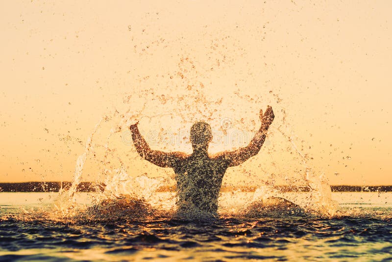 Strong Athlete Splashing in the Water at Sunset Stock Image - Image of ...