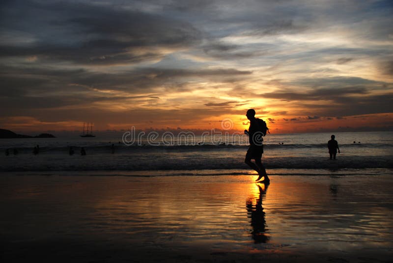 Silhouette Sun Set Running on the Beach Stock Photo - Image of moving ...