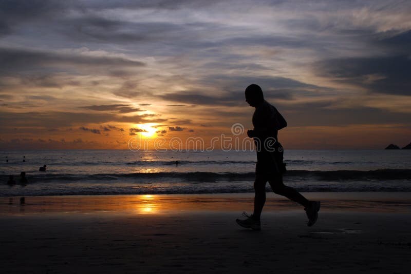 Silhouette Sun Set Running on the Beach Stock Image - Image of ...