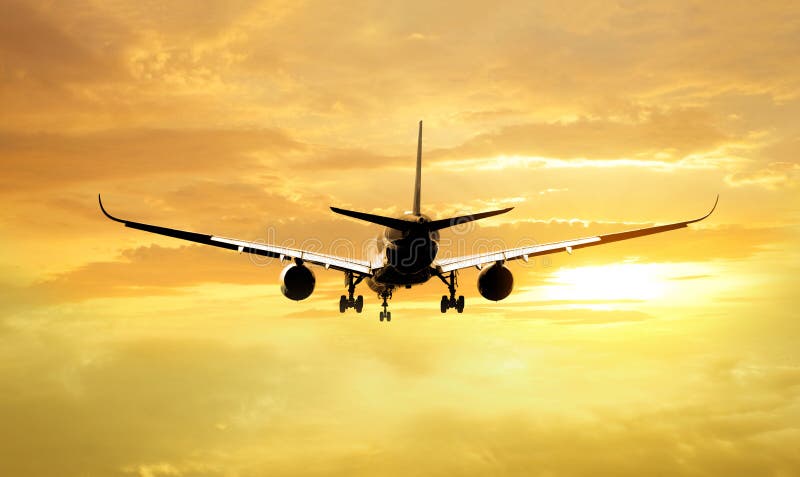 Silhouette of Sunset and Airplane Passengers Flying in the Sky To Their ...