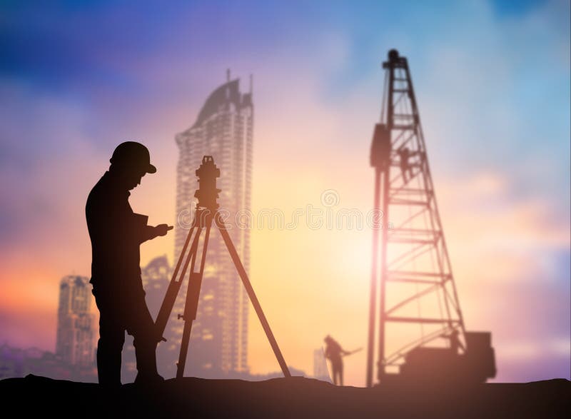 Silhouette Survey Engineer Working in a Building Site Over Blurred ...