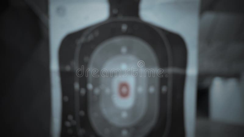A Silhouette Target at a Gun Range Slides Towards the Camera - Dark ...