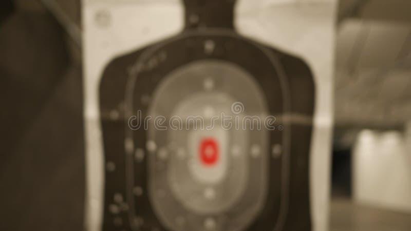 A Silhouette Target at a Gun Range Slides Away from the Camera - Dark ...
