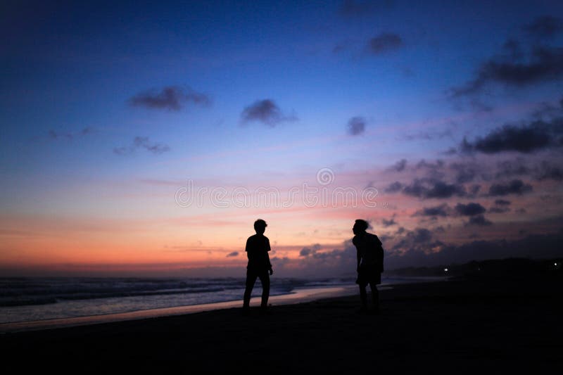 Silhouette of Two Men Standing at Sunset Stock Photo - Image of concept ...