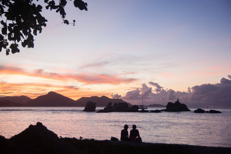 Silhouette of Two People Enjoying the Beautiful View of the Ocean ...