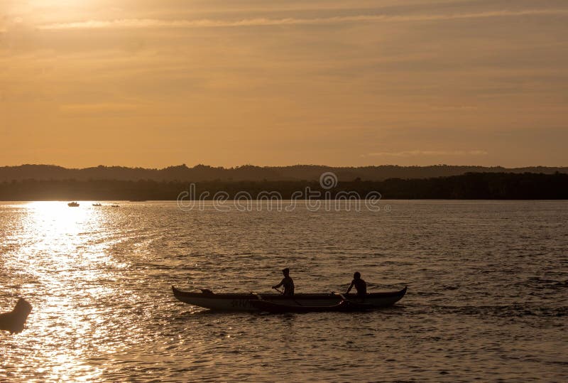 A Silhouette of Two People Rowing in a Boat Stock Image - Image of ...