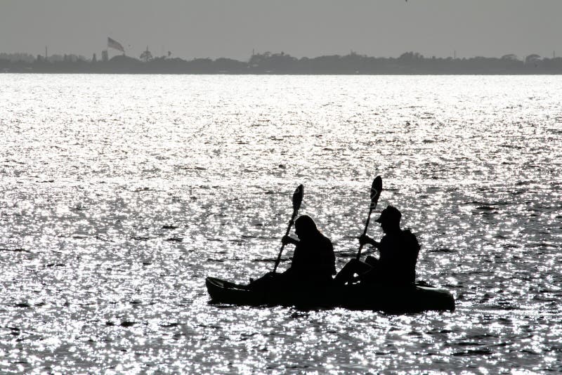 Silhouette of Two People Rowing Stock Image - Image of people, sport ...
