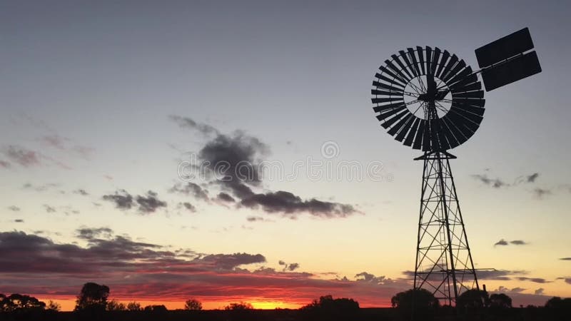 Silhouette of a Windmill in the Outback of Australia Stock Video ...