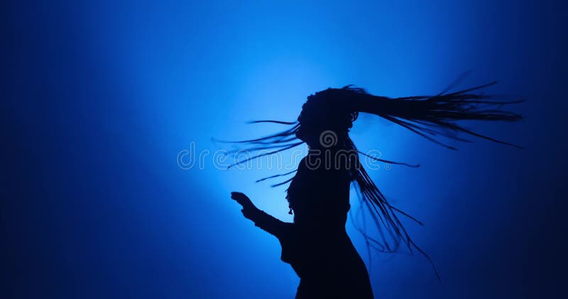 Silhouette of Woman Dancing in Blue Light and Smoke Stock Footage ...