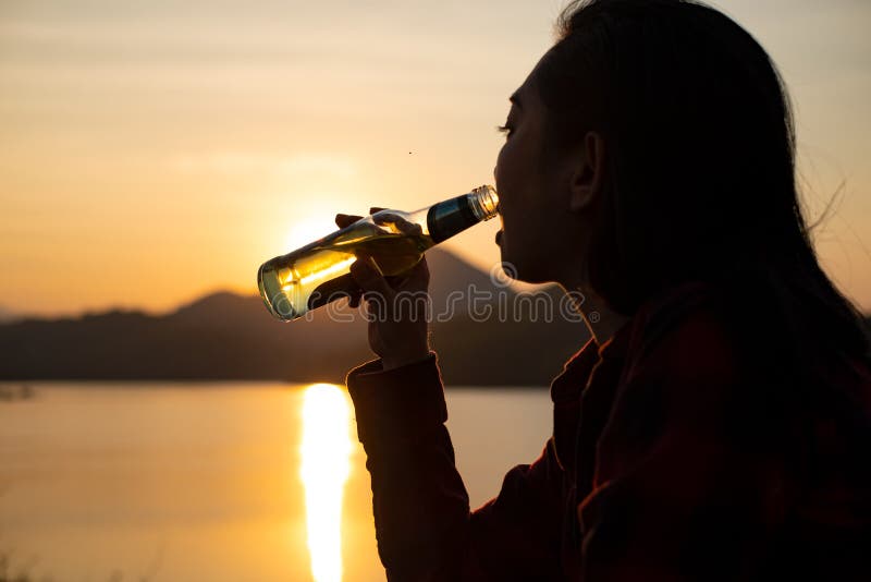 Woman Drinking Water on the Beach at Dusk Stock Image - Image of care ...