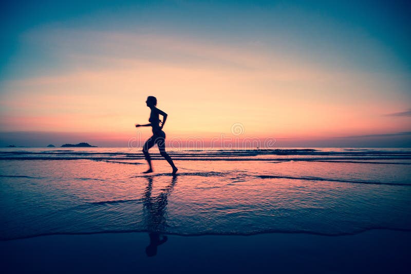Silhouette of a Woman Jogger on the Beach at Sunset Stock Image - Image ...