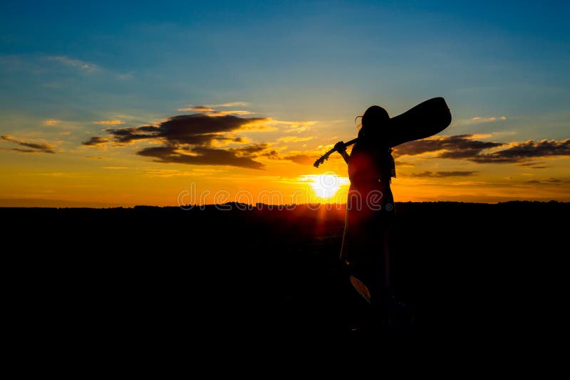 Silhouette Woman Playing Guitar in Sunset Stock Photo - Image of woman ...