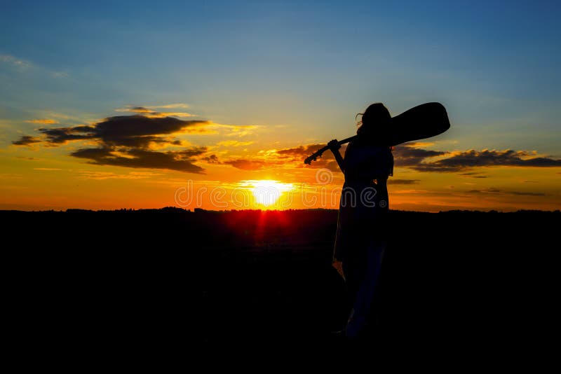 Silhouette Woman Playing Guitar in Sunset Stock Image - Image of ...