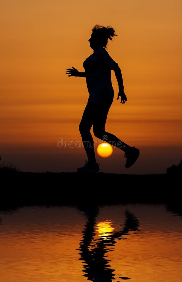 Silhouette Woman Running Against Orange Sunset Stock Photo - Image of ...