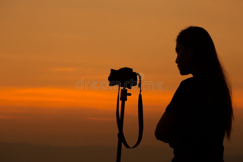 Silhouette of Woman Shooting with Camera at Sunset Stock Image - Image ...