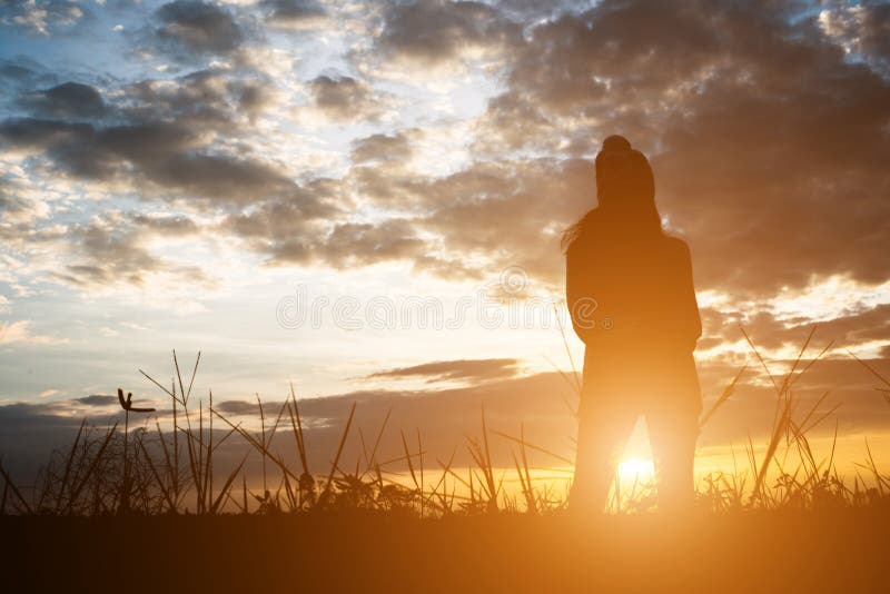 Silhouette of Woman Standing on Field during Sunset. Stock Image ...