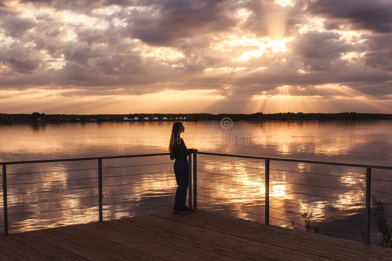 Silhouette of Woman. Sun Rays from Clouds Stock Photo - Image of beach ...