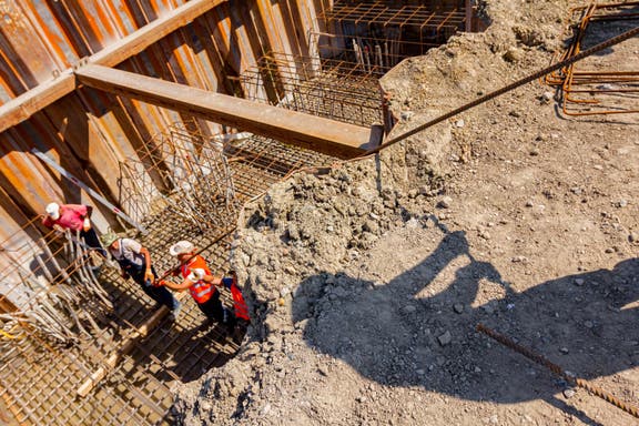Silhouette of Worker with Rebar Rod Installing Skeleton of Reinforcing ... Silhouette of Worker with Rebar Rod Installing Skeleton of Reinforcing ...