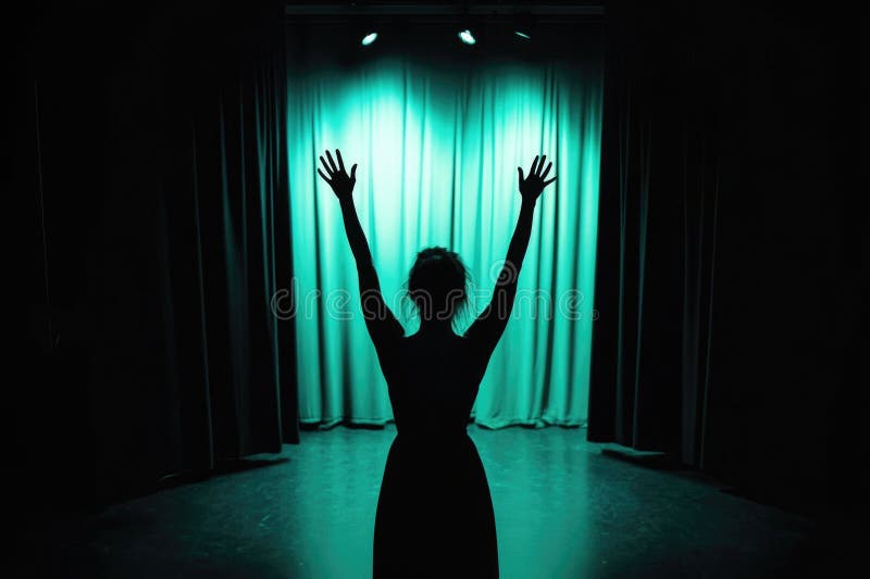Silhouette of Young Female Performer on Stage with Dramatic Lighting ...