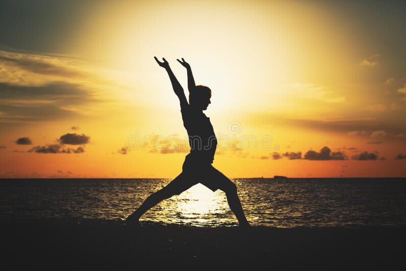 Silhouette of Young Man Doing Yoga at Sunset Stock Photo - Image of ...