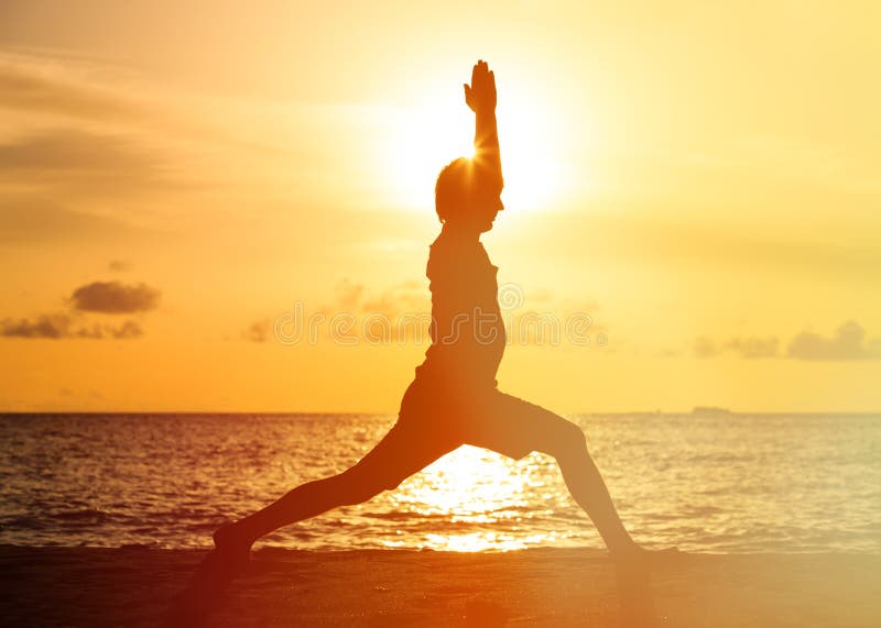 Silhouette of Young Man Doing Yoga at Sunset Stock Photo - Image of ...