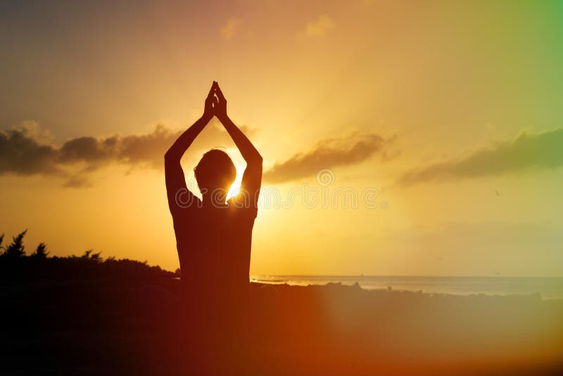 Silhouette of Young Man Doing Yoga at Sunset Stock Photo - Image of ...