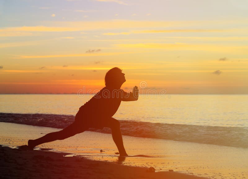 Silhouette of Young Man Doing Yoga at Sunset Stock Photo - Image of ...
