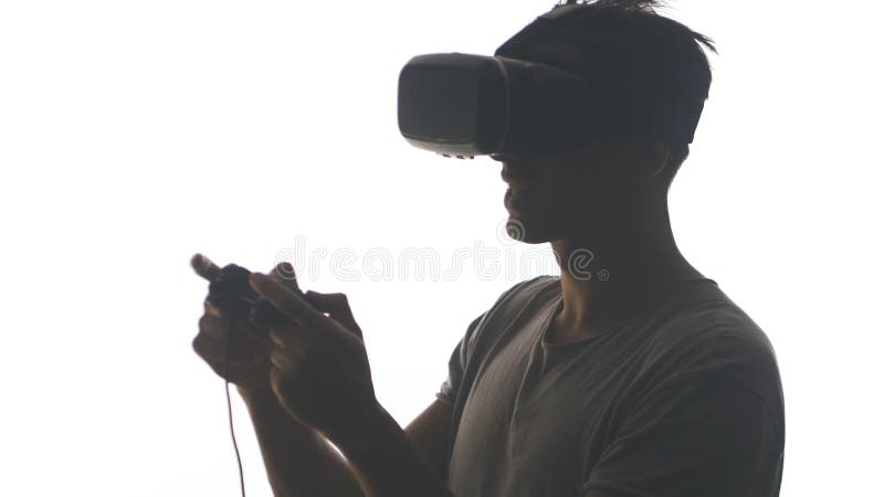 Silhouette of Young Man Playing Game in Vr Glasses. Guy Gets Experience ...