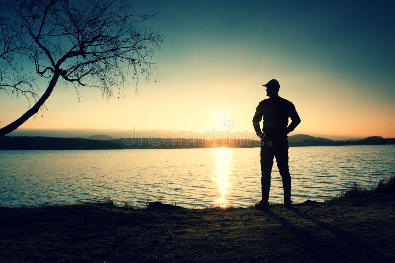 Silhouette of Young Man Stand on Beach at Sunset. Shadow of Active Man ...