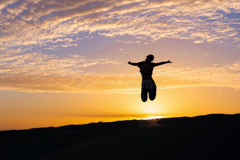 Silhouette of a Young Woman Jumping in the Sun Stock Image - Image of ...