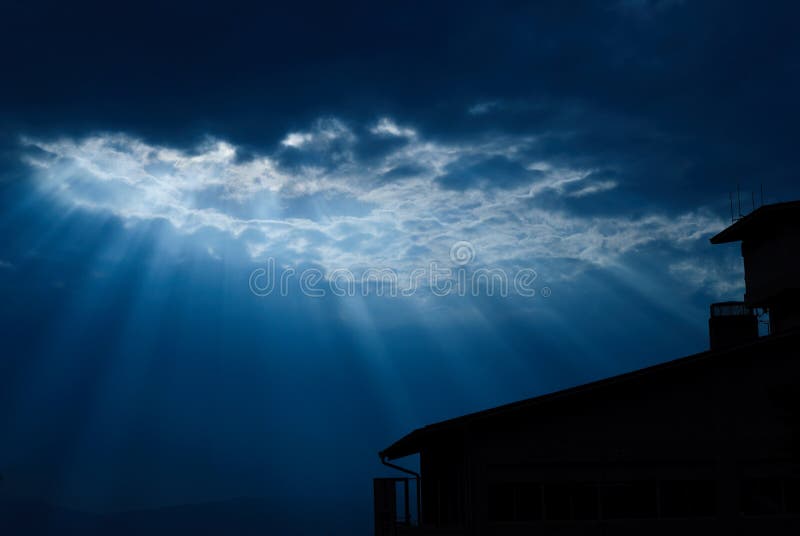Silhouetted Building and Sun Rays Stock Photo - Image of shining, light ...