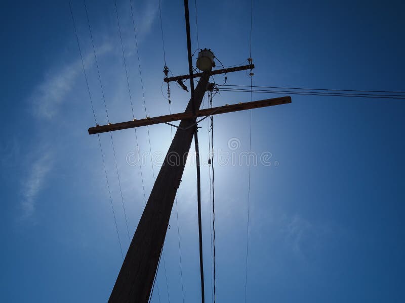 Silhouetted electric post stock photo. Image of blue - 93251182