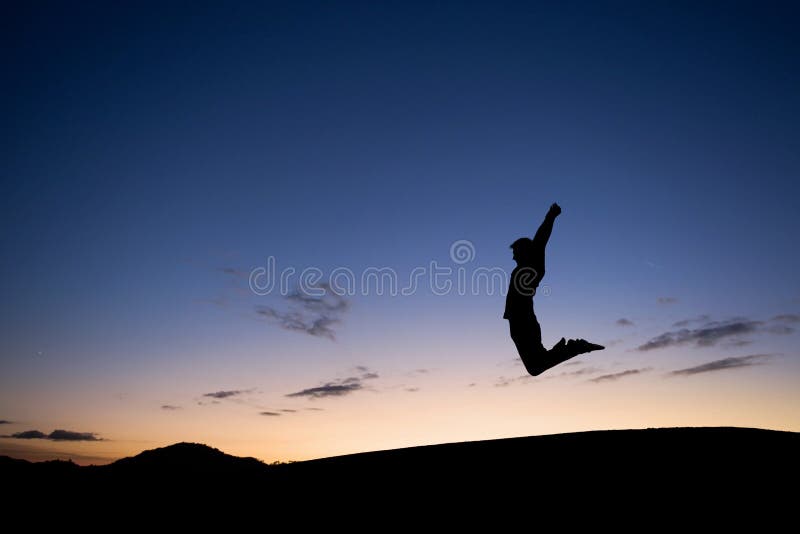 Silhouetted Man Jumping in Sunset Stock Image - Image of excitement ...