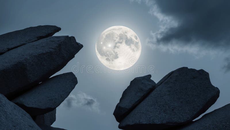Silhouetted Rock Formations with a Glowing Moon in a Cloudy Sky. Stock ...