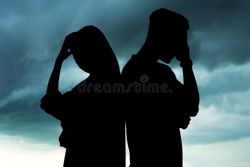 Silhouettes of Arguing Couple Against Sky with Rainy Clouds ...
