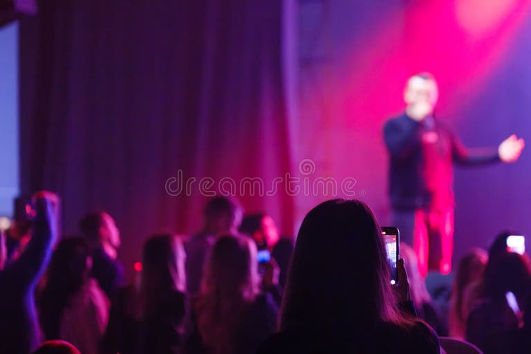 Silhouettes of Audience during Live Performance with Vibrant Lighting ...