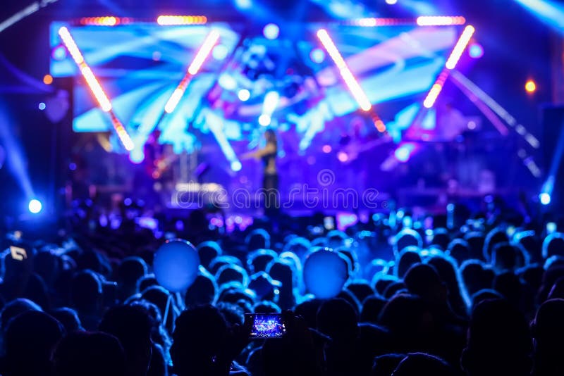 Silhouettes of Concert Crowd in Front of Bright Stage Lights Stock ...