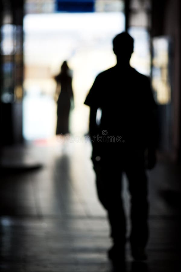 Woman Standing Over Man