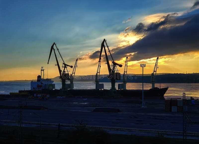 In port at sunset stock photo. Image of boat, loading - 85965850
