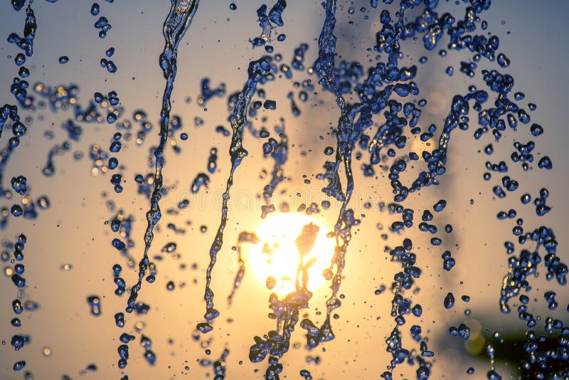 Silhouettes of Drops Falling Water Fountain Against the Backdrop of the ...