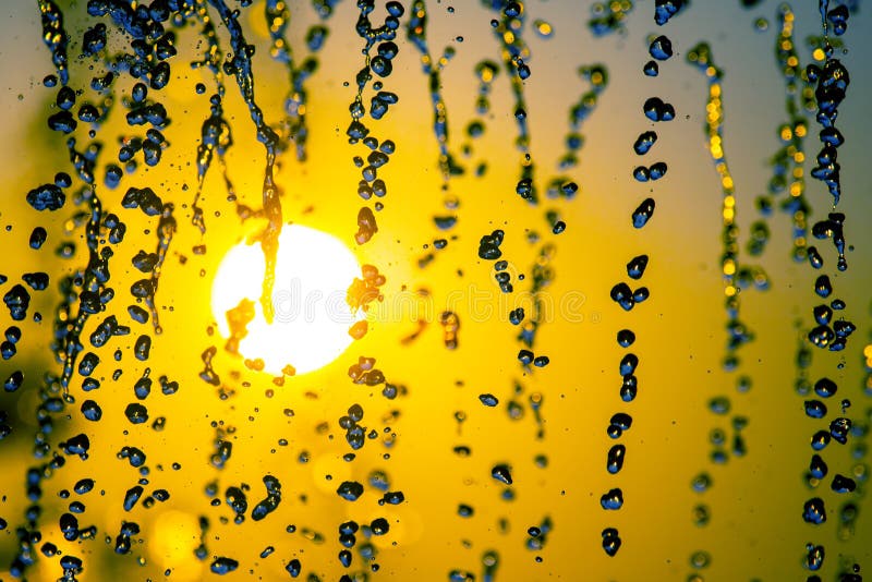Silhouettes of Drops Falling Water Fountain Against the Backdrop of the ...