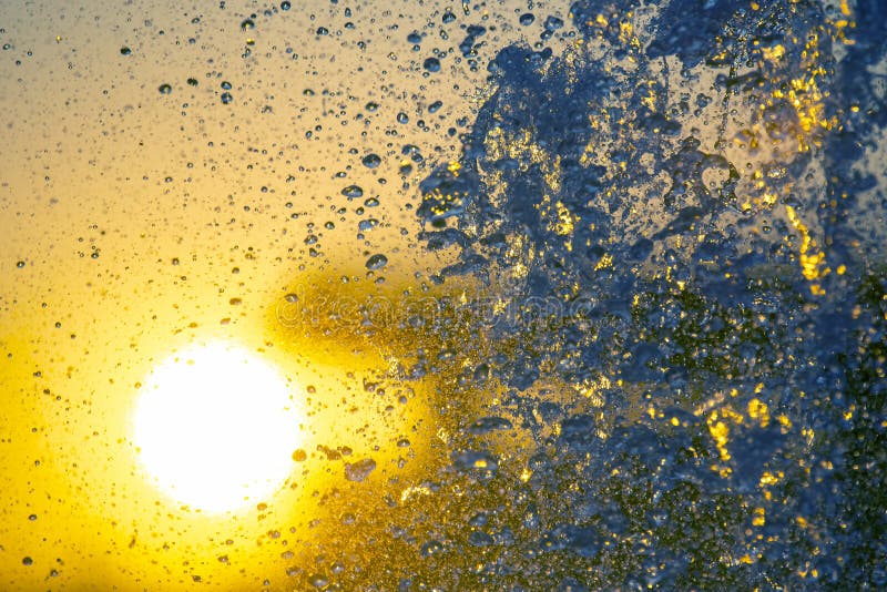 Silhouettes of Drops Falling Water Fountain in the Setting Sun Stock ...