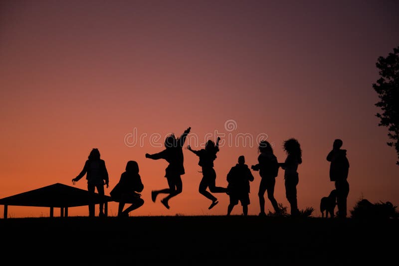 Silhouettes of Friends Dancing at Sunset Stock Photo - Image of purple ...